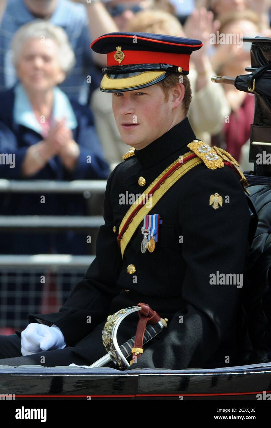Prince Harry travels in an open carriage at Trooping the Colour ...