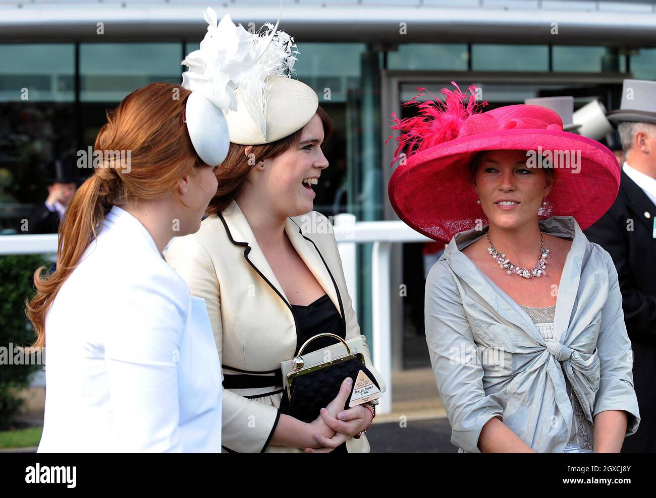 Princess Beatrice (L) and Princess Eugenie (C) joke with Mrs Peter ...