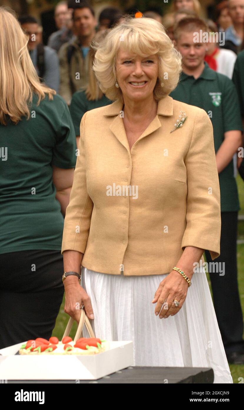 Camilla, Duchess of Cornwall stands with her Birthday cake as she visis ...