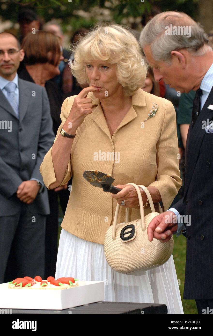 Camilla, Duchess of Cornwall tries some Birthday cake as she visis the ...