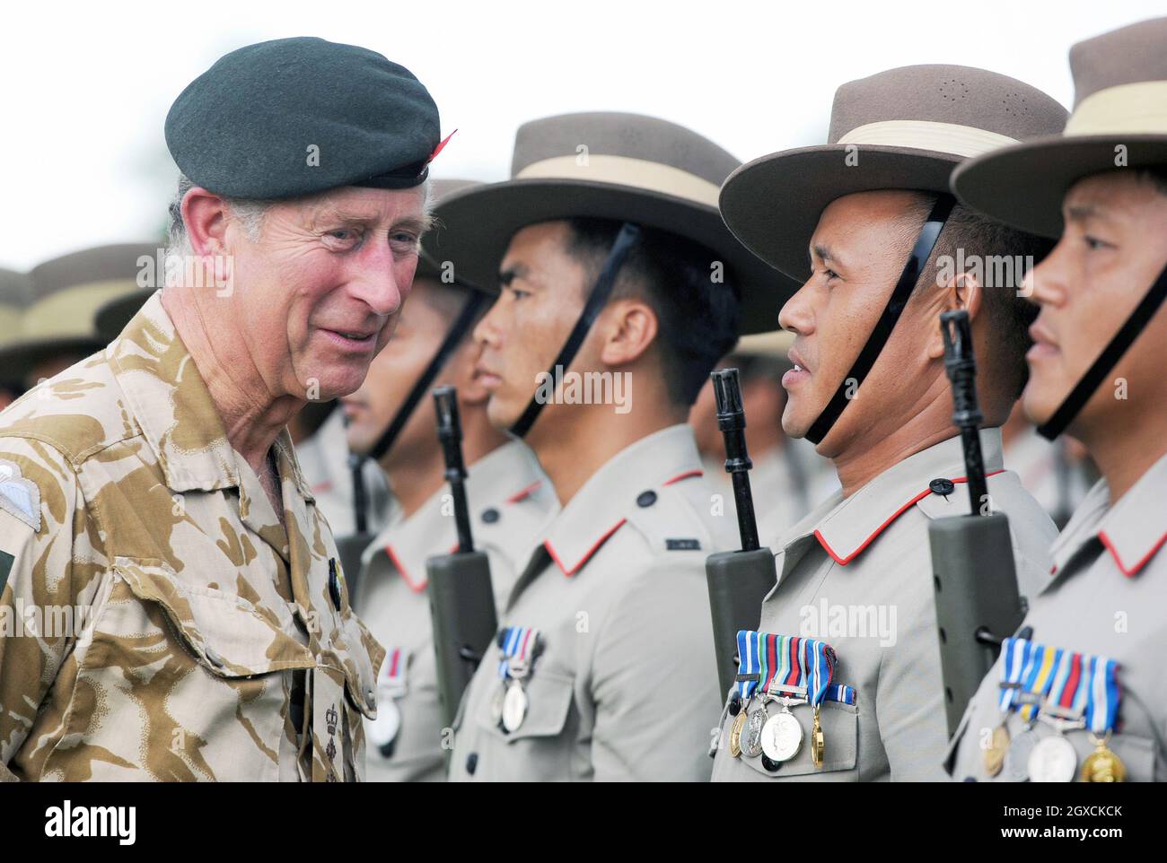The Prince of Wales inspects a Gurkha guard of honour when he arrives ...
