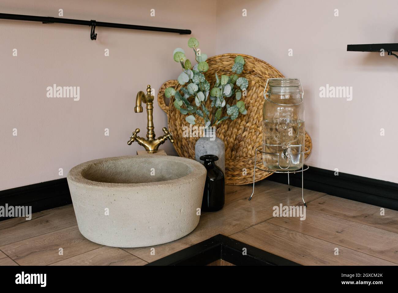 Wooden kitchen with a beautiful decor and a stone sink and a vintage ...