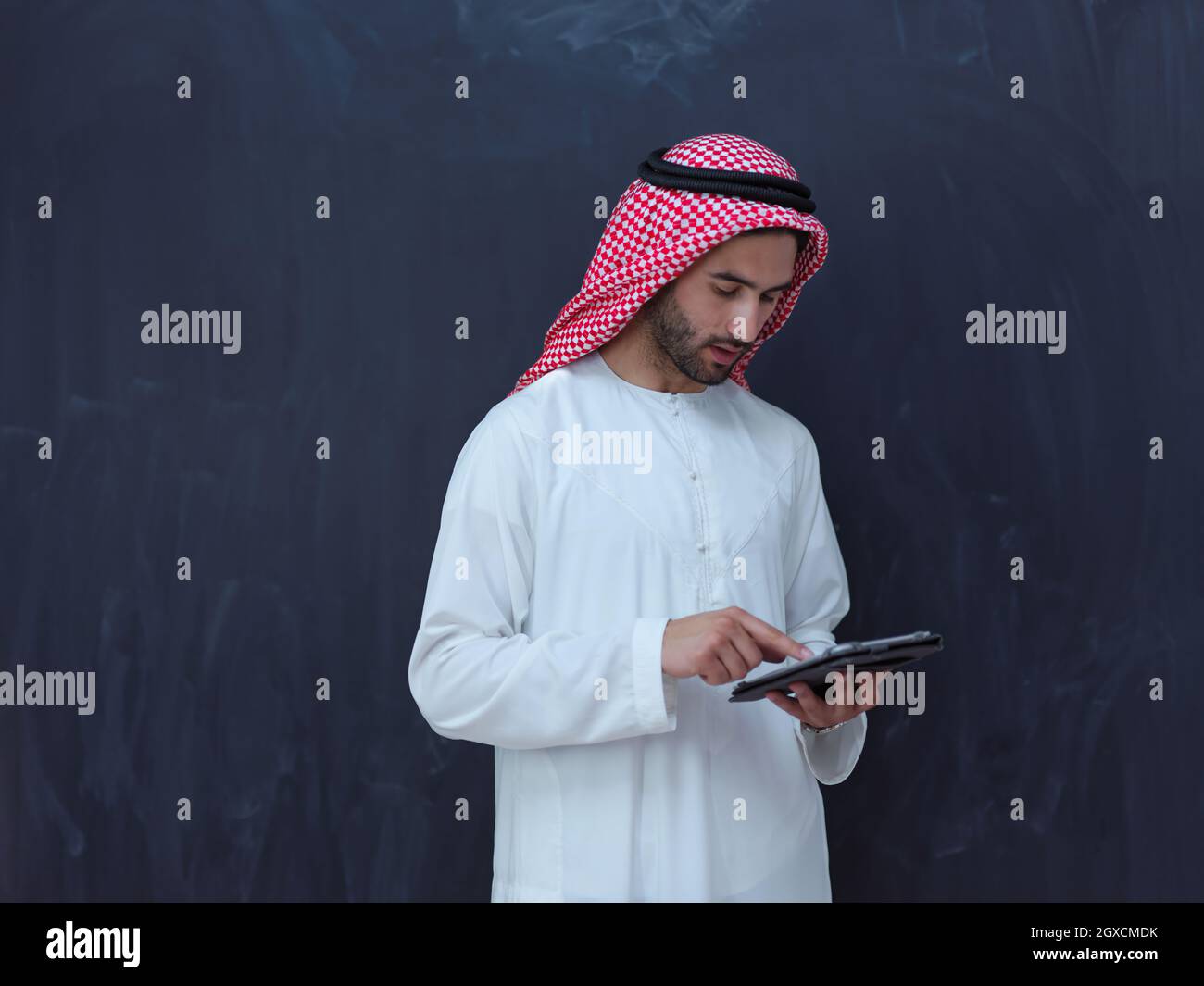 young arabian muslim businessman using tablet computer wearing hijab ...