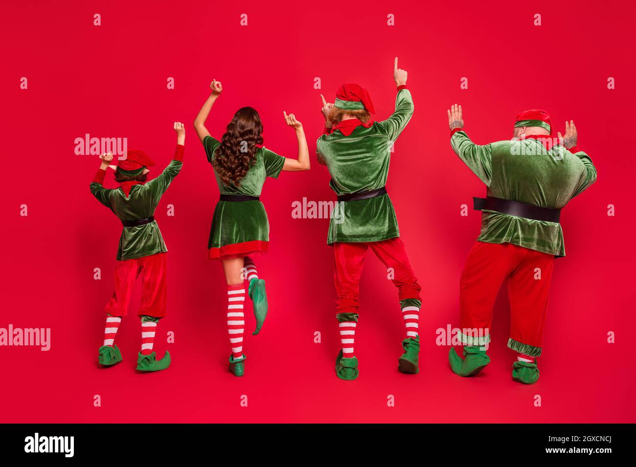 Back rear spine view full body photo of people elf dance christmas ...