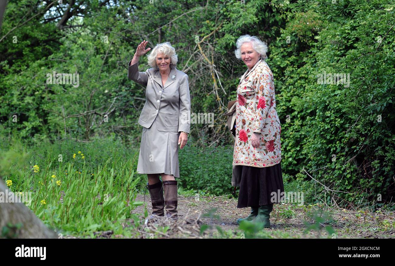 The Duchess of Cornwall, accompanied by aide Amanda Macmanus, waves as ...