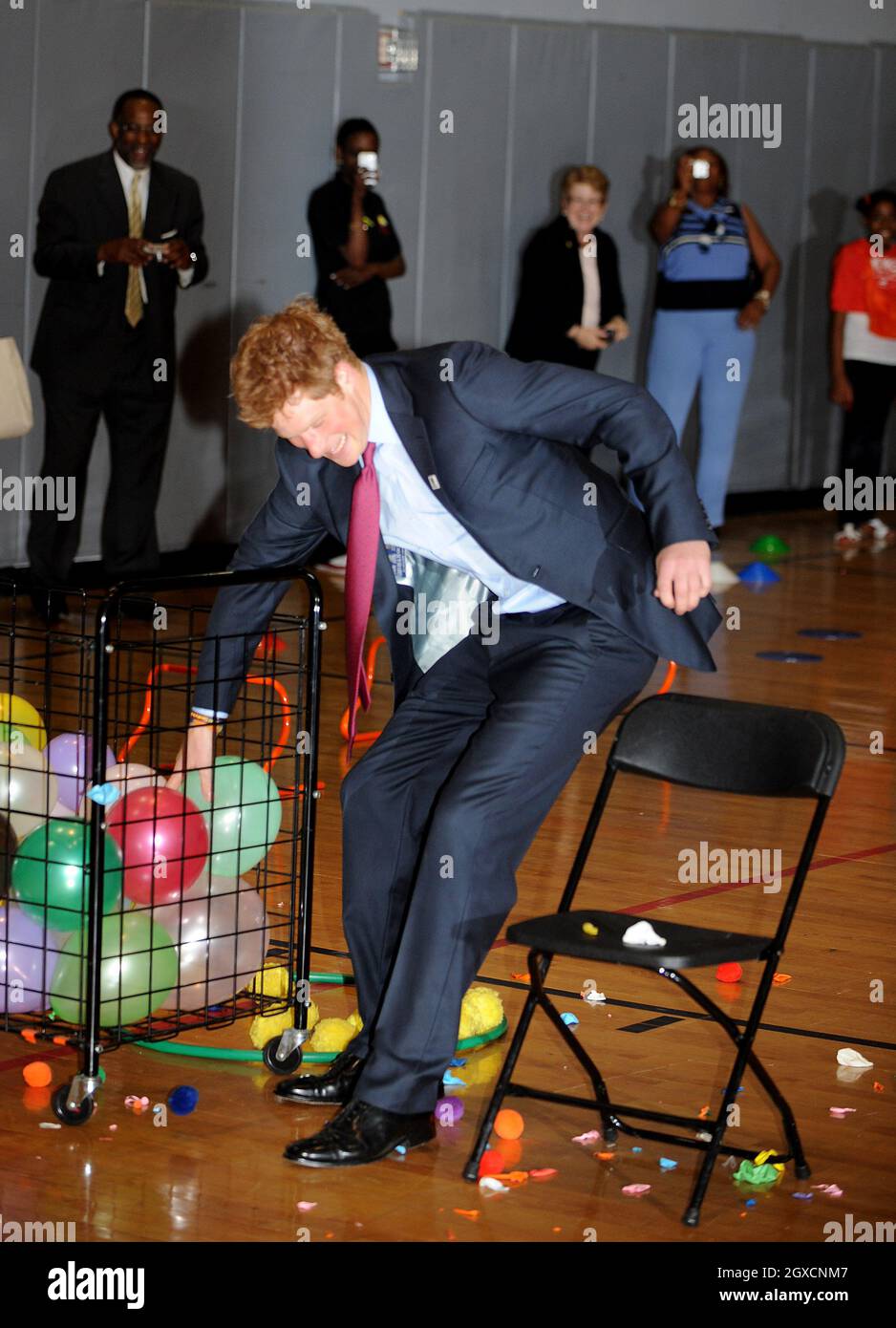 Prince Harry takes part in an obstical race at the Harlem Children's ...