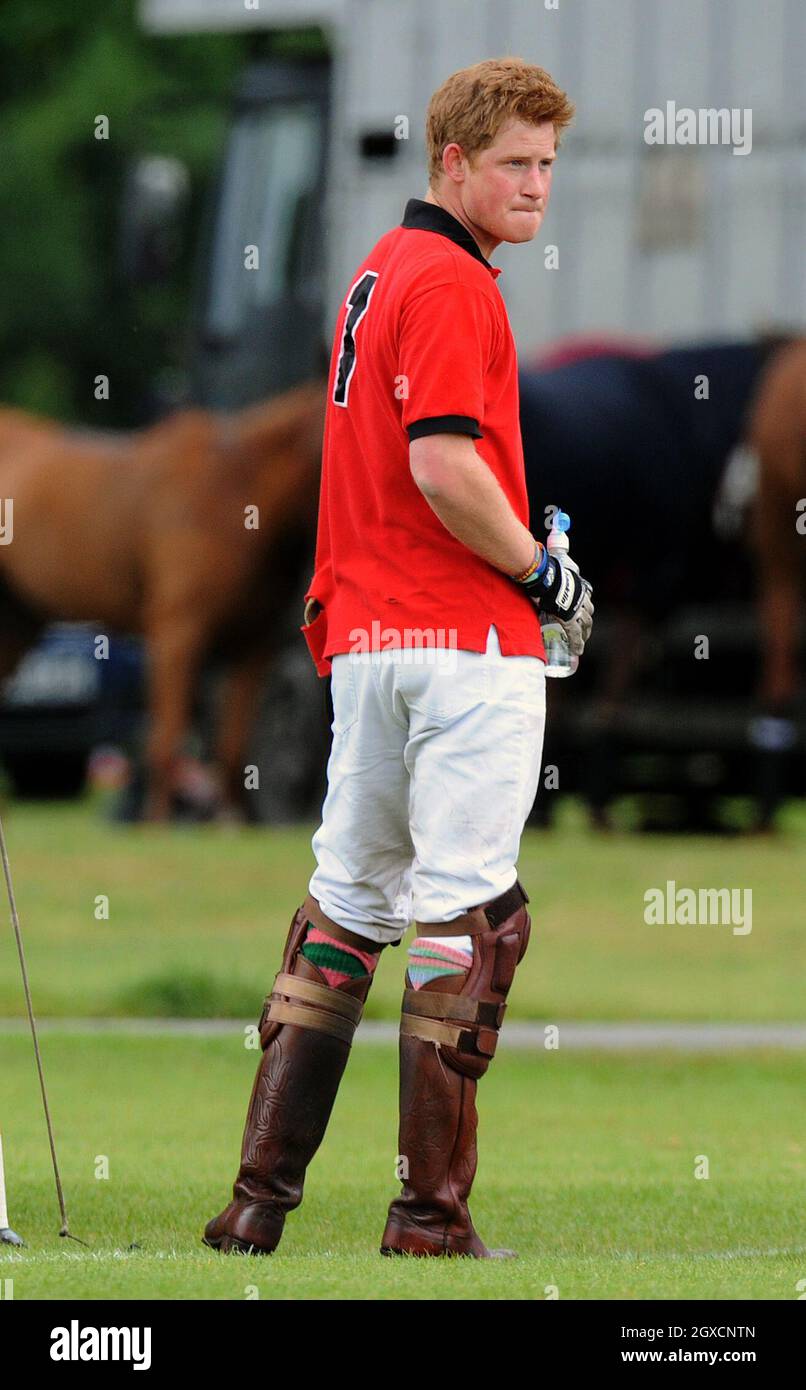 Prince Harry takes part in a charity polo match at Cirencester Park ...