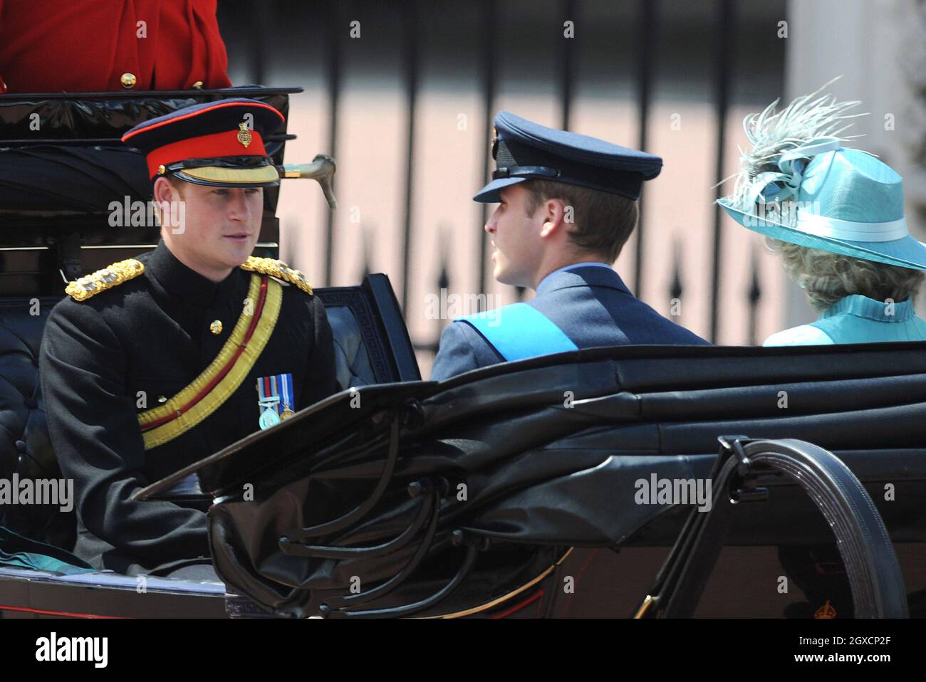 Prince Harry rides in a horse drawn carriage with Prince William and ...