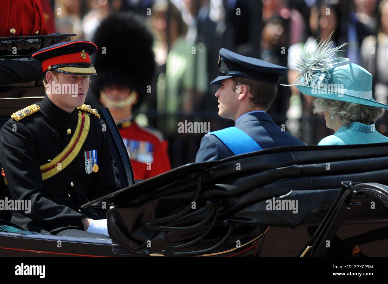 Prince Harry rides in a horse drawn carriage with Prince William and ...