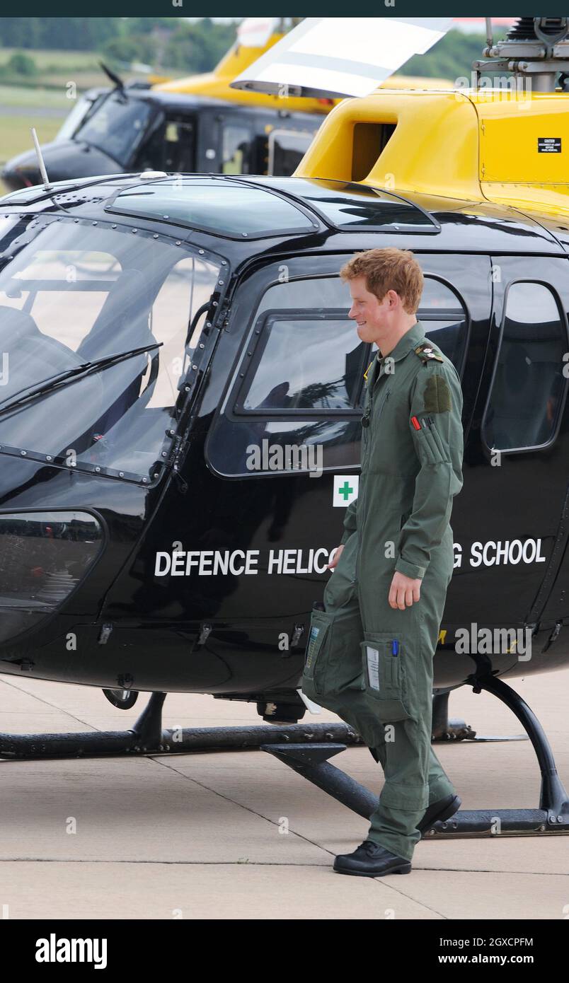 Prince Harry attends a photocall during his military helicopter ...