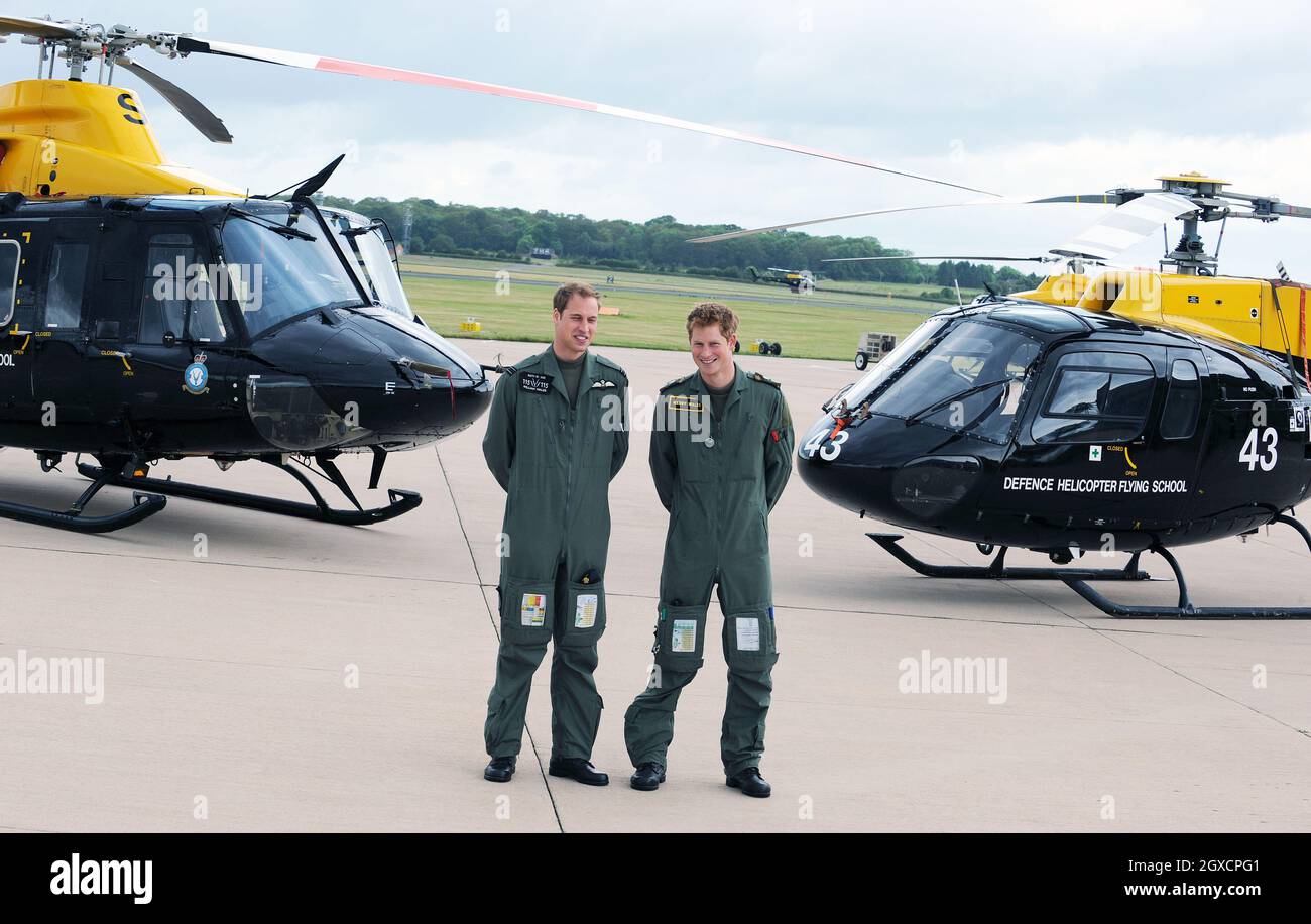 Prince William and Prince Harry pose during their military helicopter ...