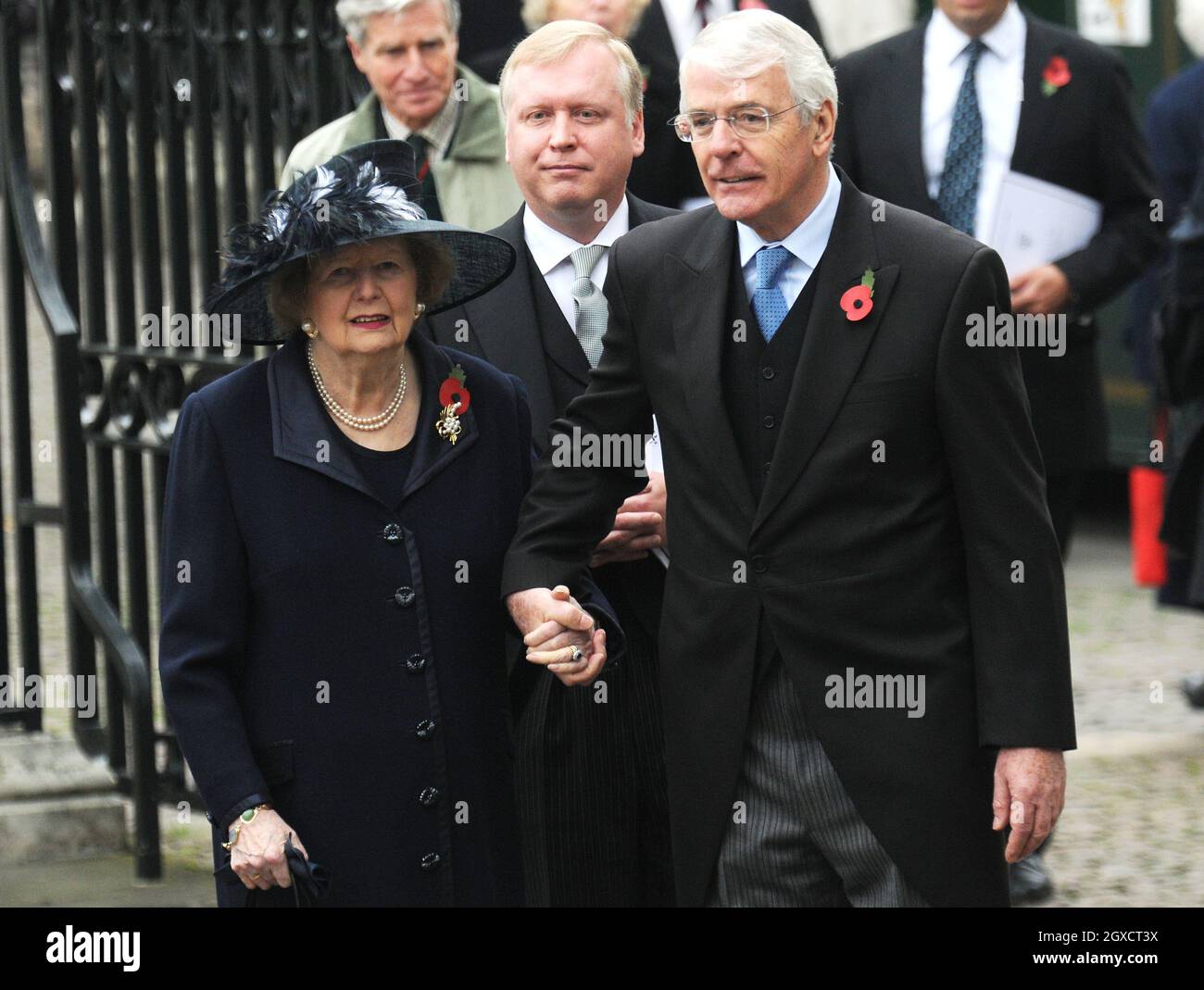 Sir John Major and Baroness Margaret Thatcher leave a special service ...