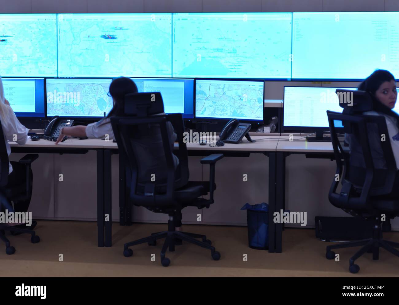 Group Of Female Security Operators Working In A Data System Control Room Technical Operators