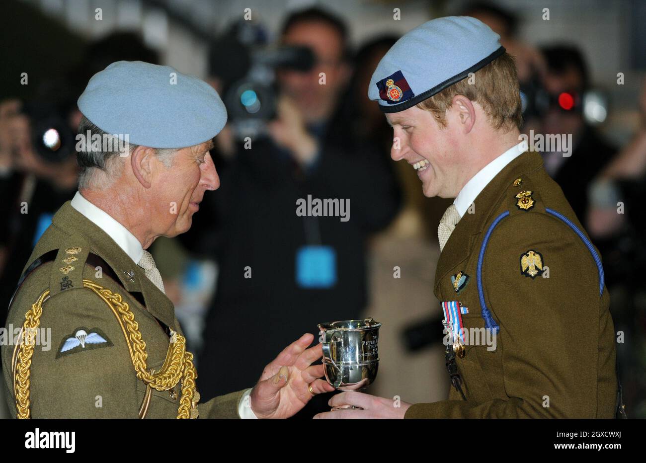 Prince Charles, Prince of Wales presents Prince Harry with a cup for ...