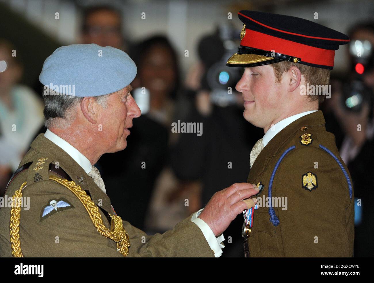 Prince Charles, Prince of Wales presents Prince Harry with his flying ...