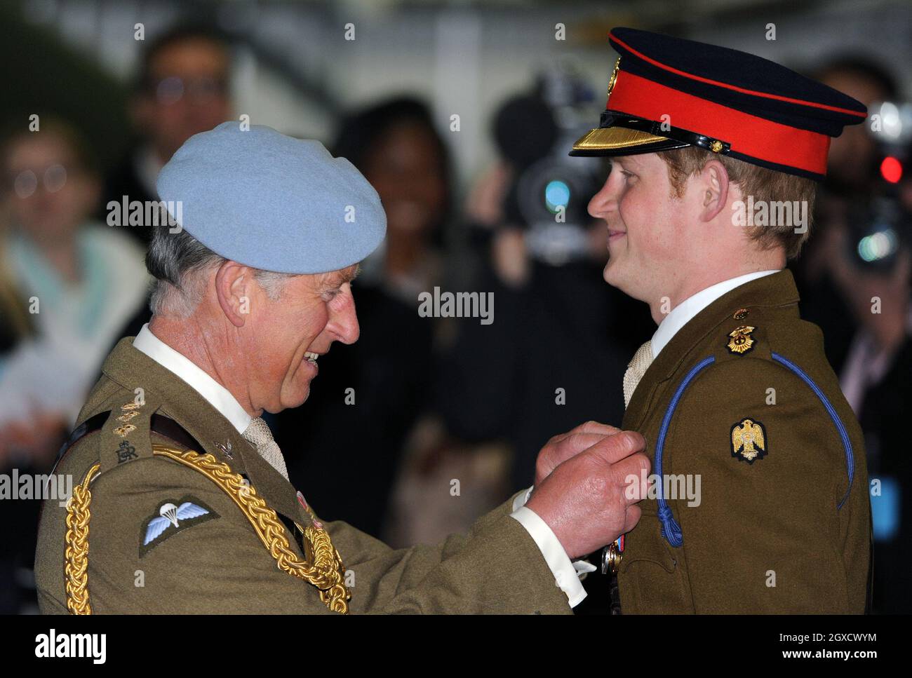 Prince Charles, Prince of Wales presents Prince Harry with his flying ...