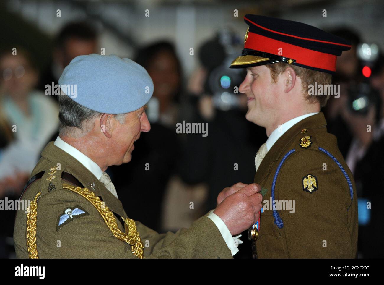 Prince Charles, Prince of Wales presents Prince Harry with his flying ...