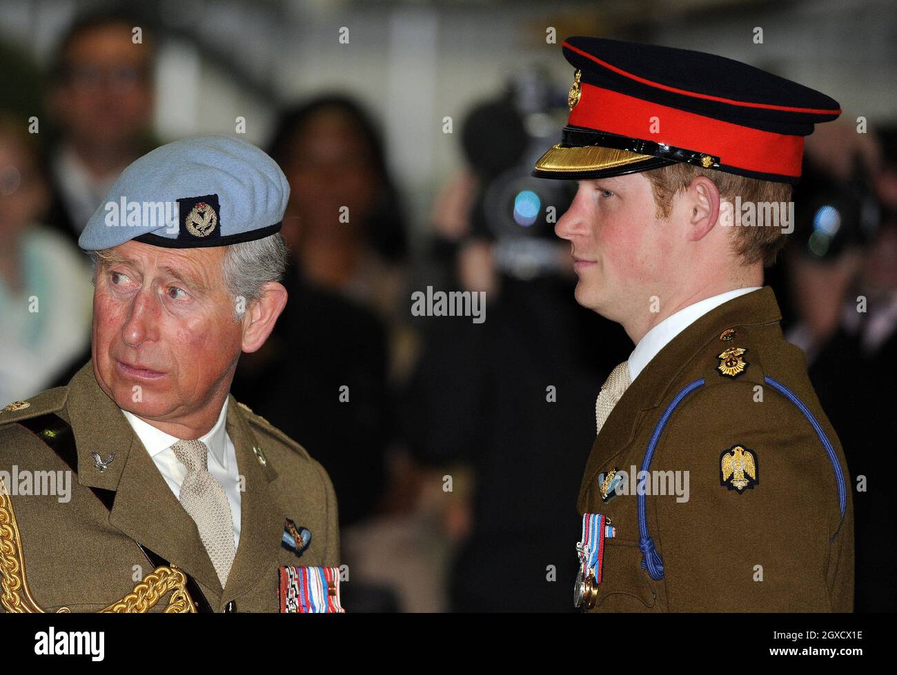Prince Charles, Prince of Wales presents Prince Harry with his flying ...