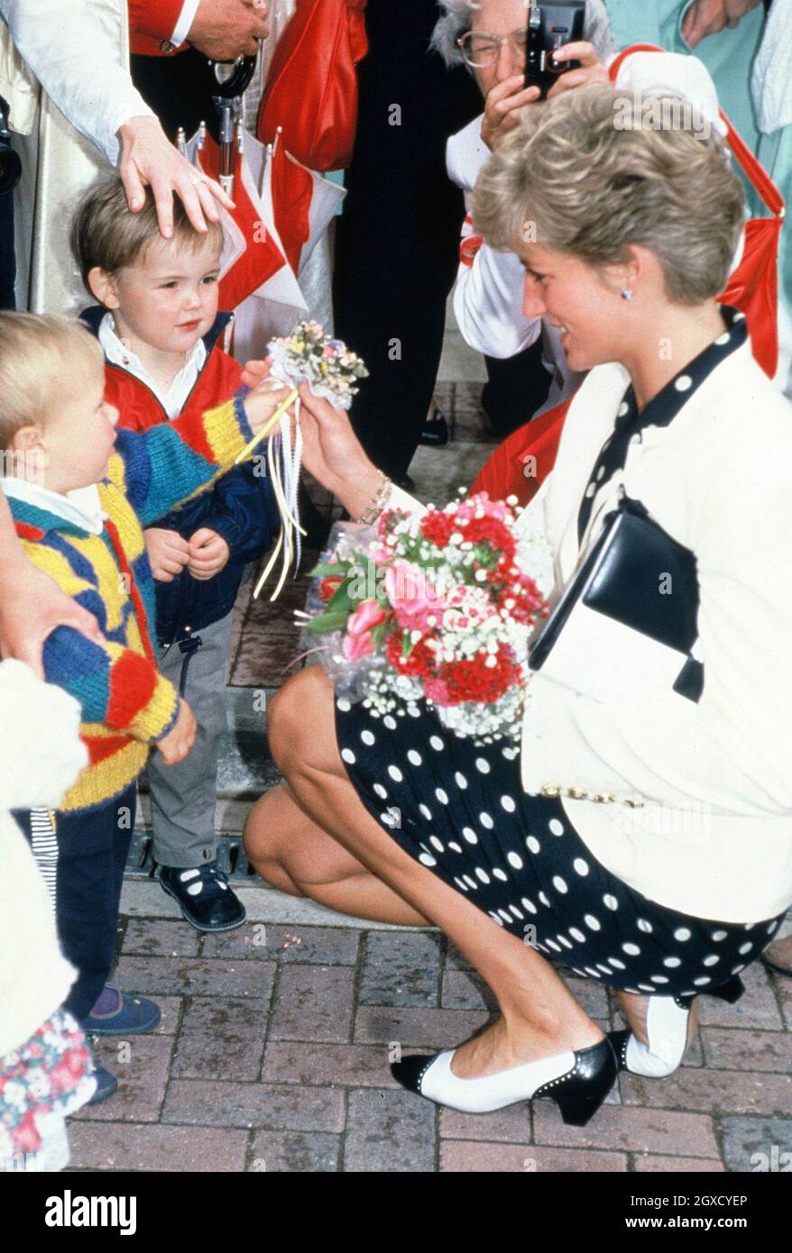 Princess Diana chats with little children as she arrives for a media ...