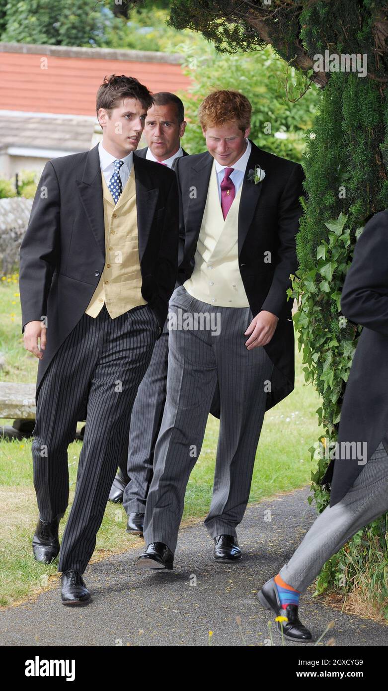 Prince Harry (R) attends the wedding of his former Equerry Mark Dyer to ...