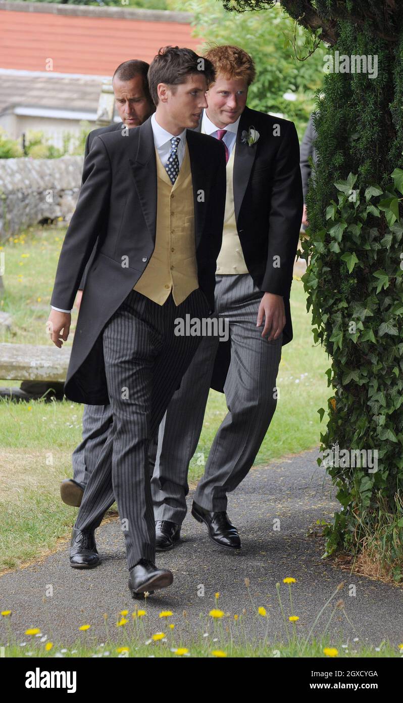 Prince Harry (R) attends the wedding of his former Equerry Mark Dyer to ...