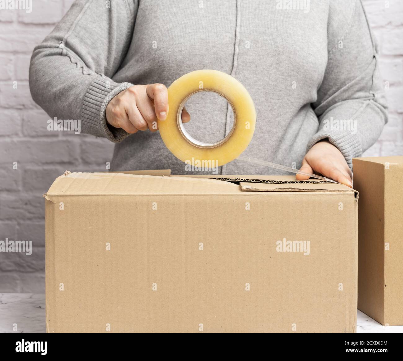 Woman duct tape hi-res stock photography and images - Alamy