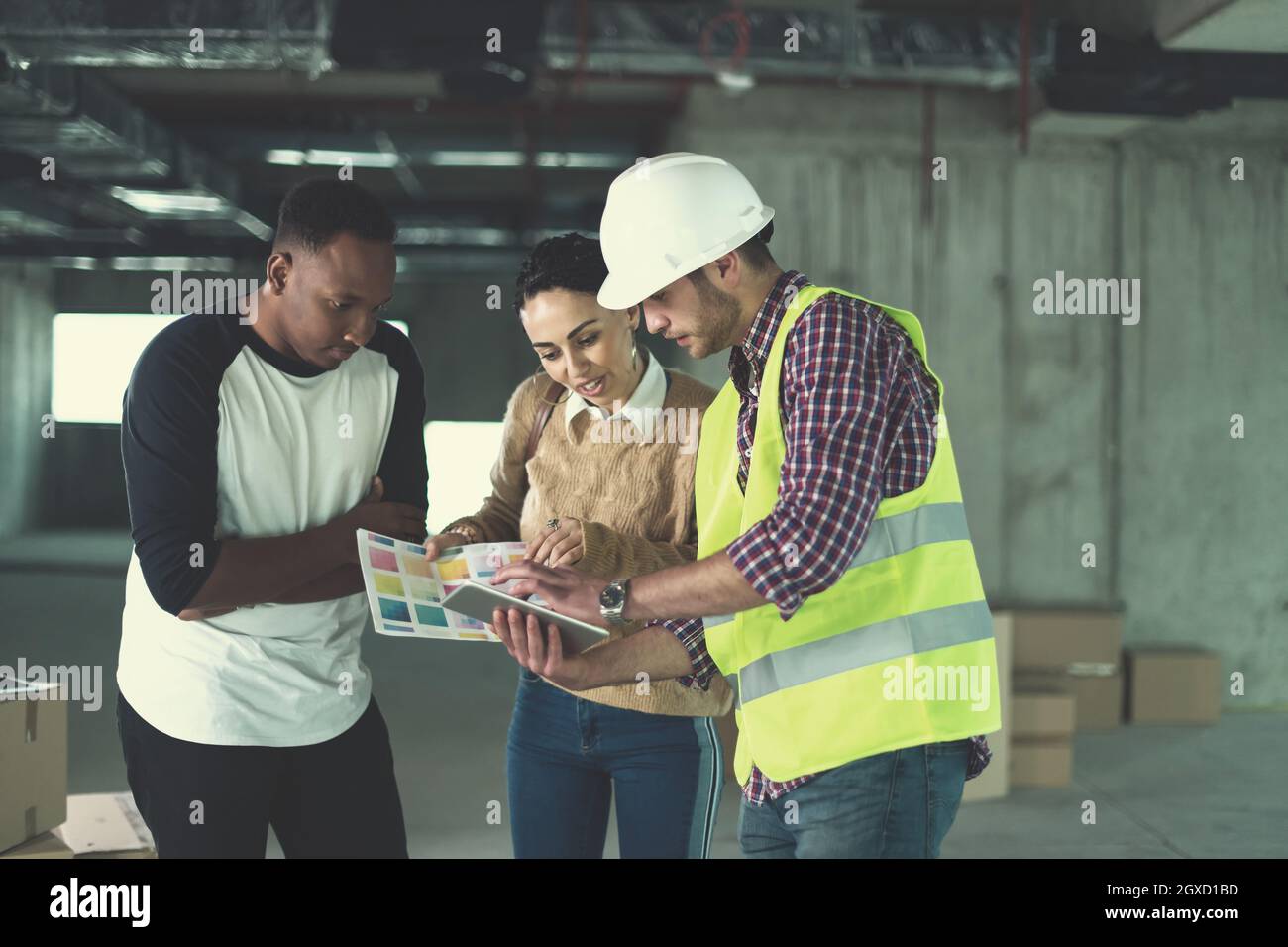 architect engineer using tablet computer while showing house design ...