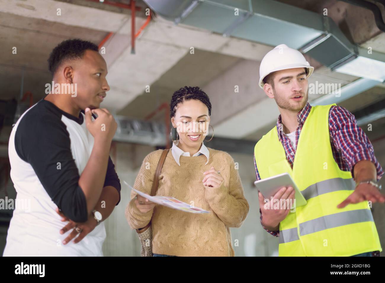 architect engineer using tablet computer while showing house design ...