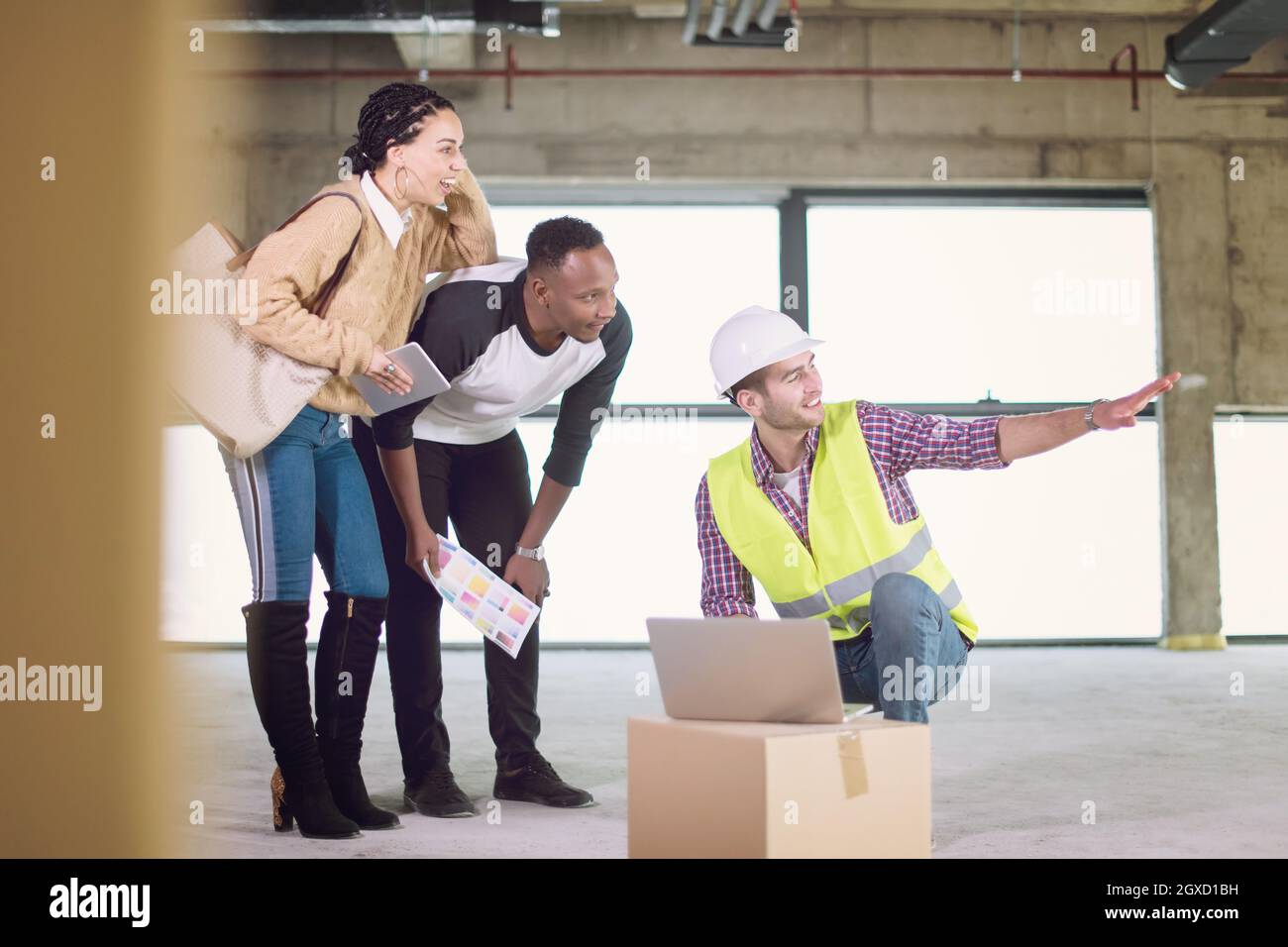 architect engineer using laptop computer while showing house design ...