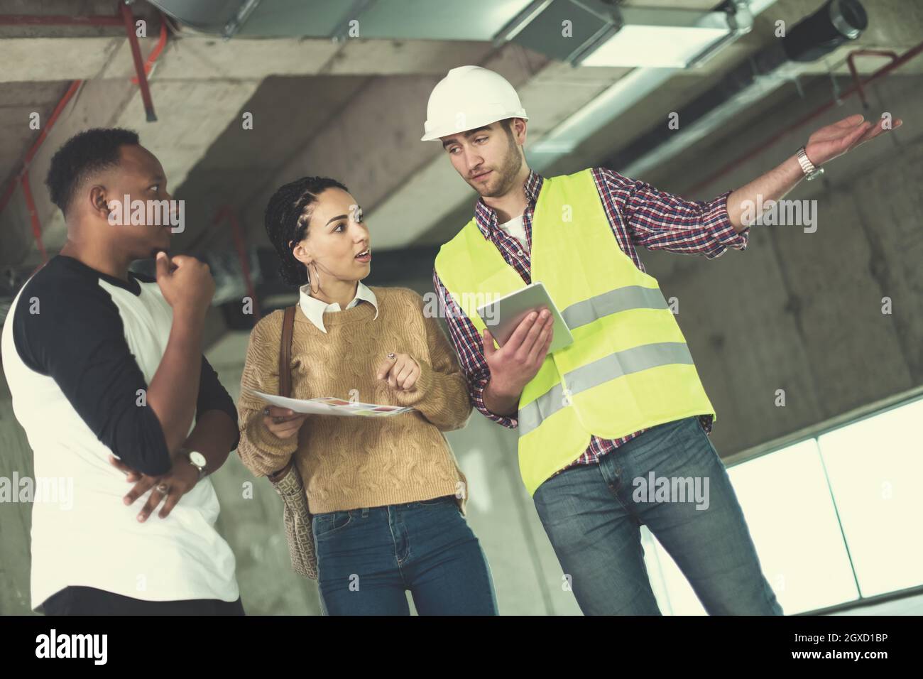 architect engineer using tablet computer while showing house design ...