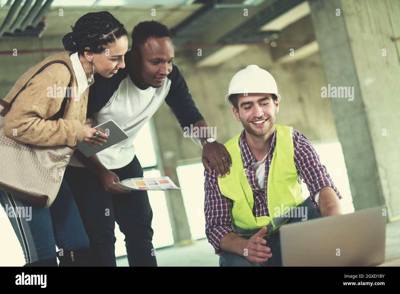 architect engineer using laptop computer while showing house design ...