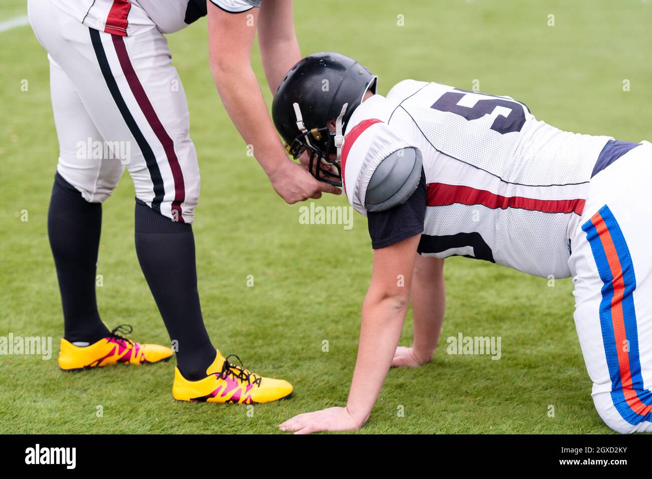group of young professional american football players in action during ...
