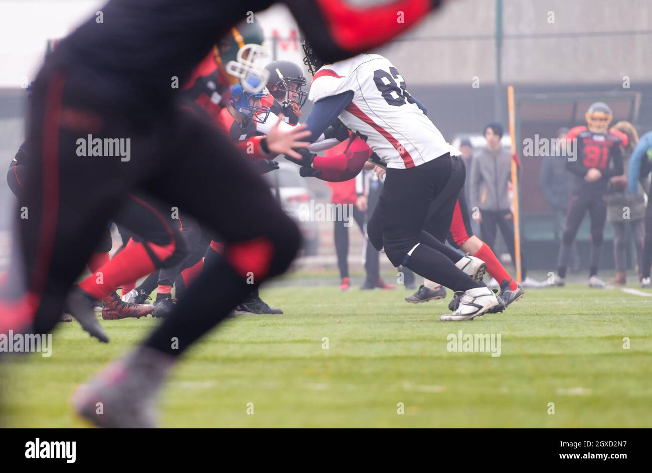 group of young professional american football players in action during ...