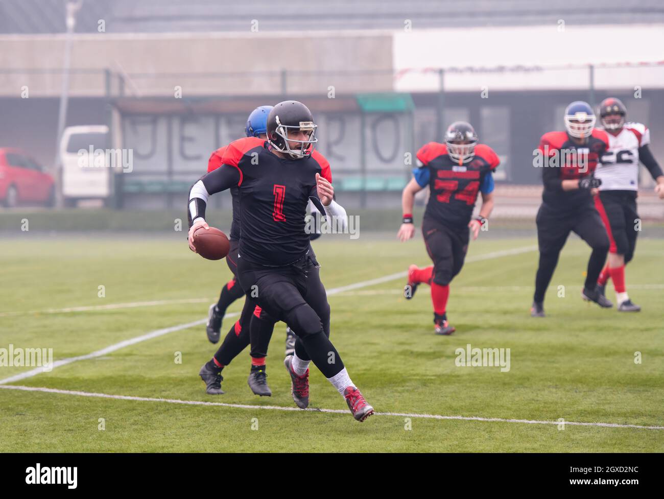 group of young professional american football players in action during ...