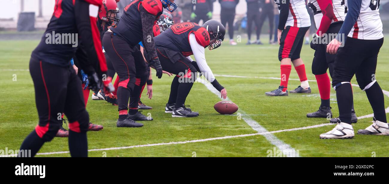 group of young professional american football players ready to start ...