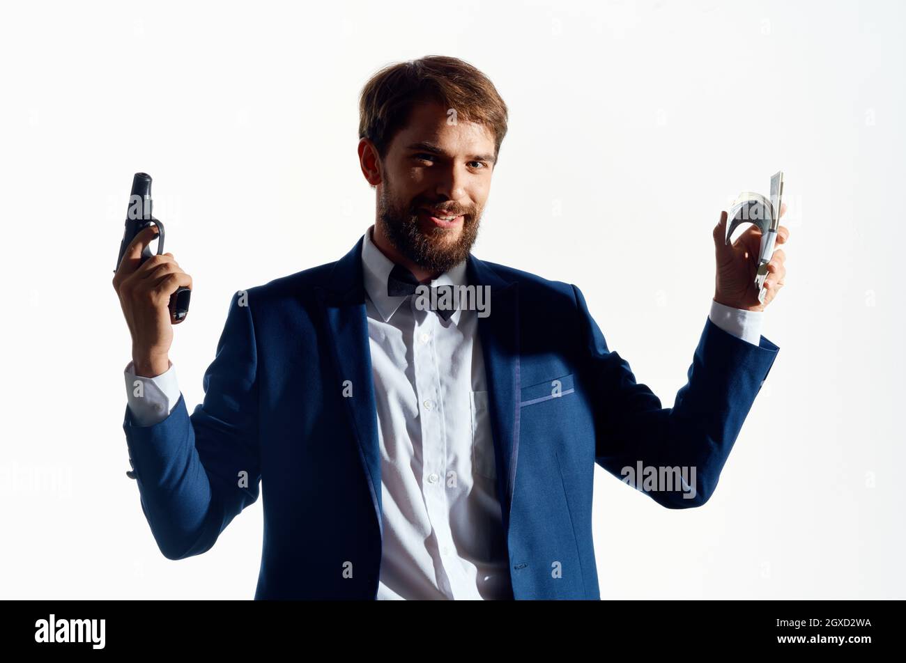 Businessmen secret agent gun hi-res stock photography and images - Alamy