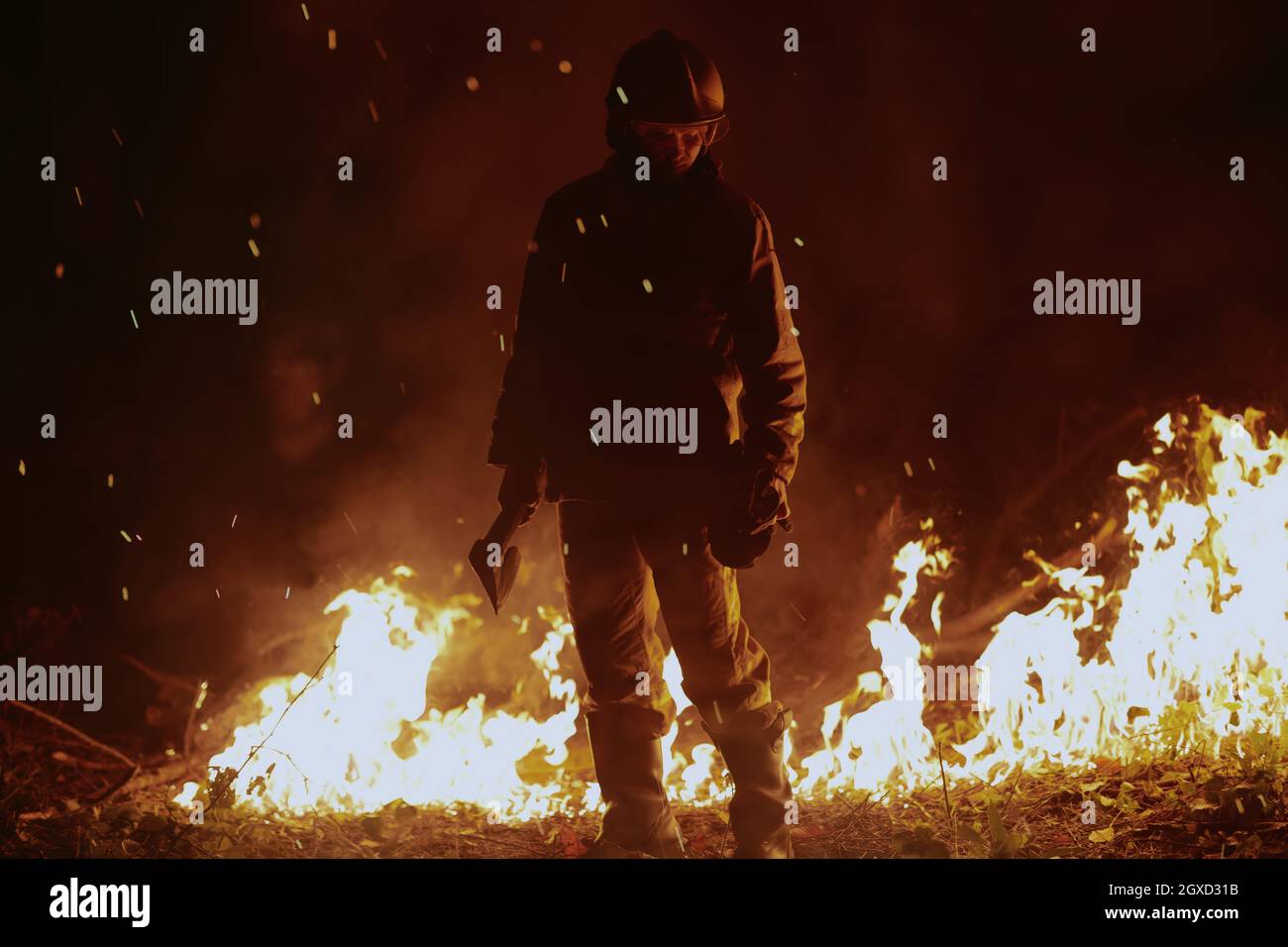 firefighter portrait on authentic fire location in forest Stock Photo ...