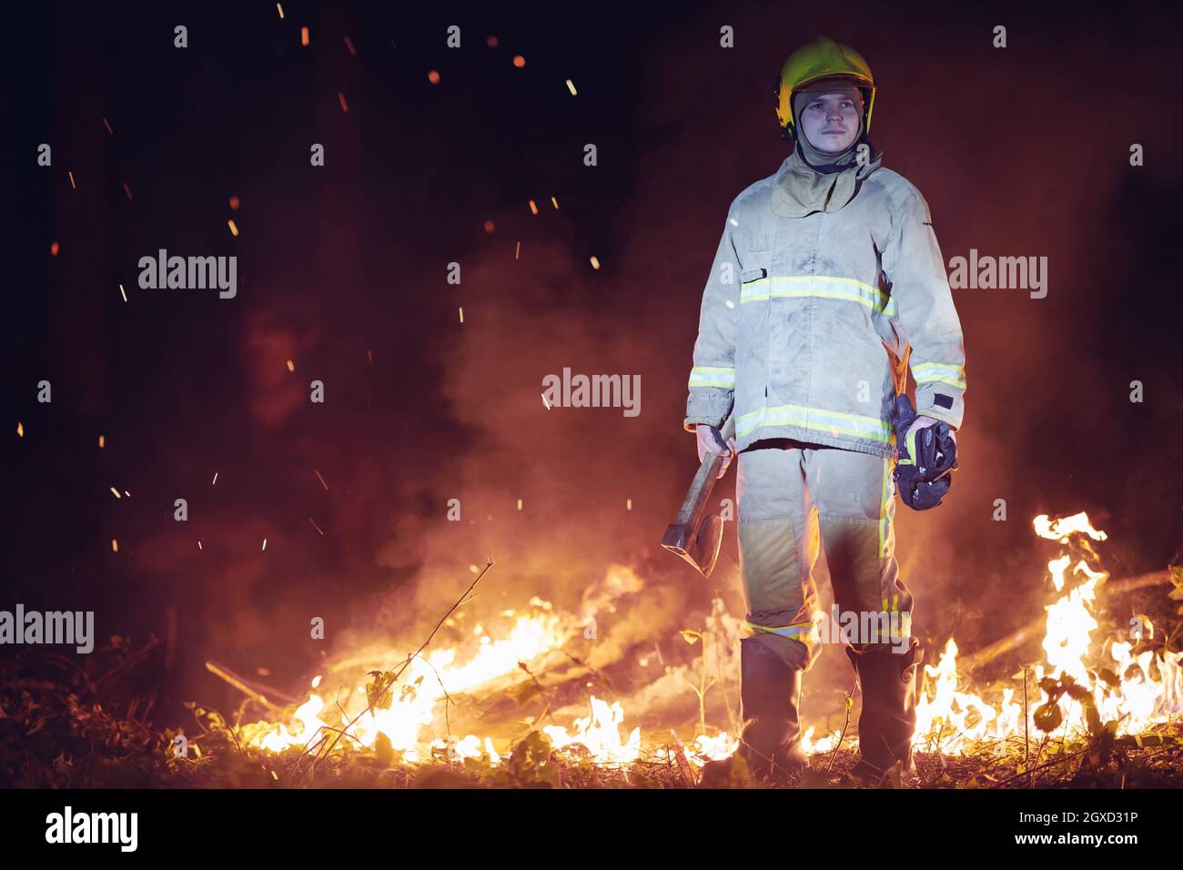firefighter portrait on authentic fire location in forest Stock Photo ...