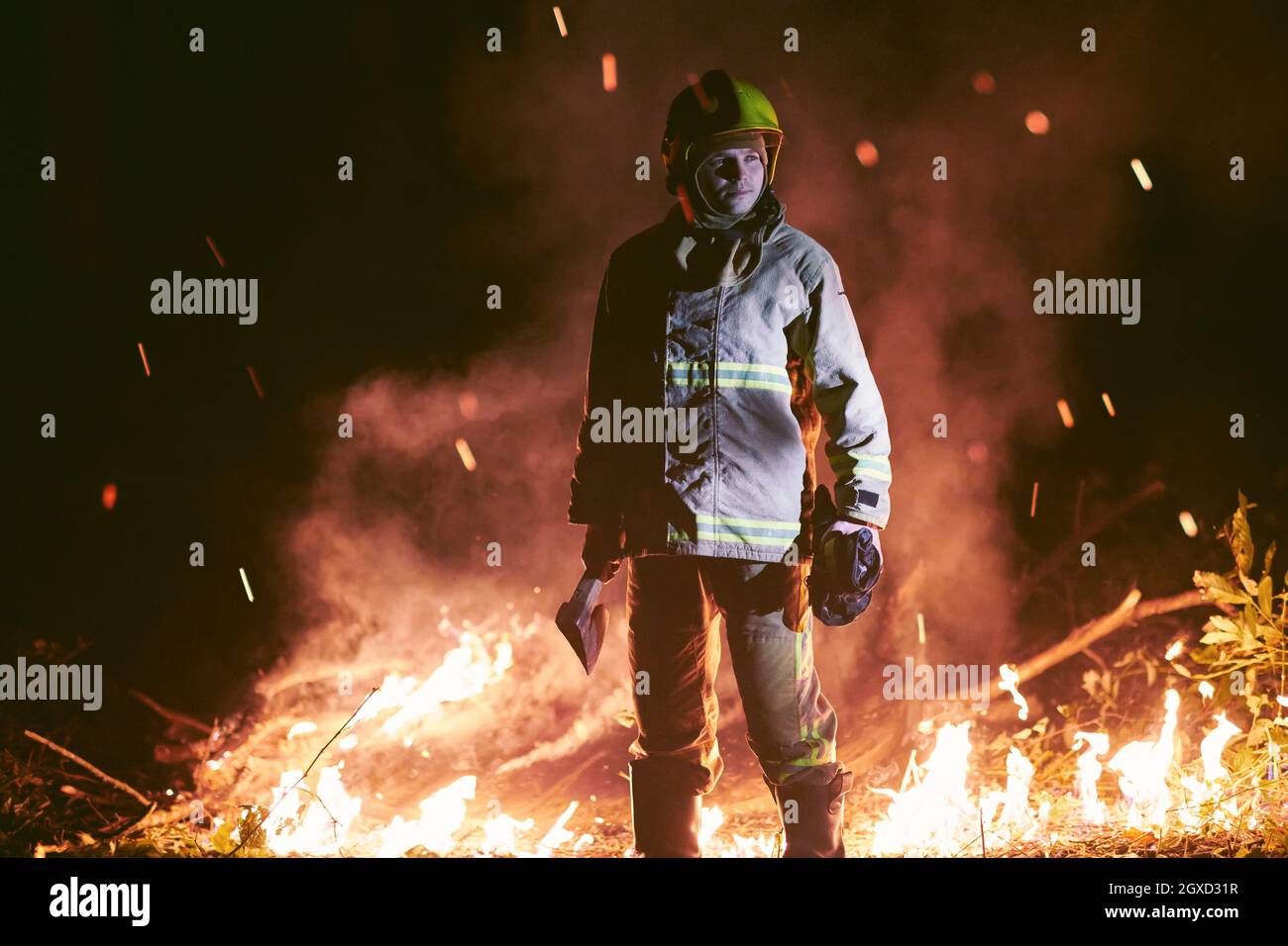 firefighter portrait on authentic fire location in forest Stock Photo ...