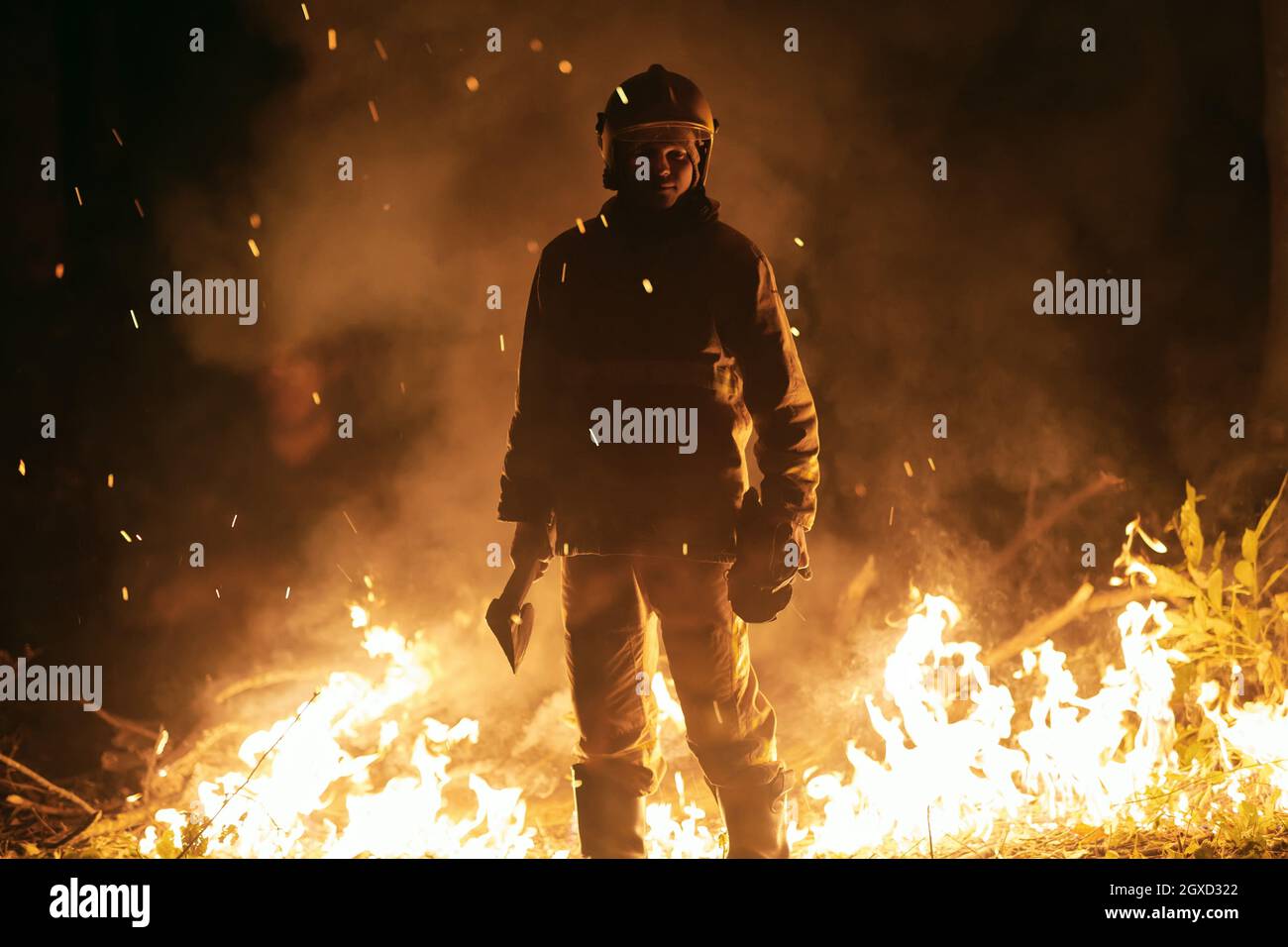 firefighter portrait on authentic fire location in forest Stock Photo ...