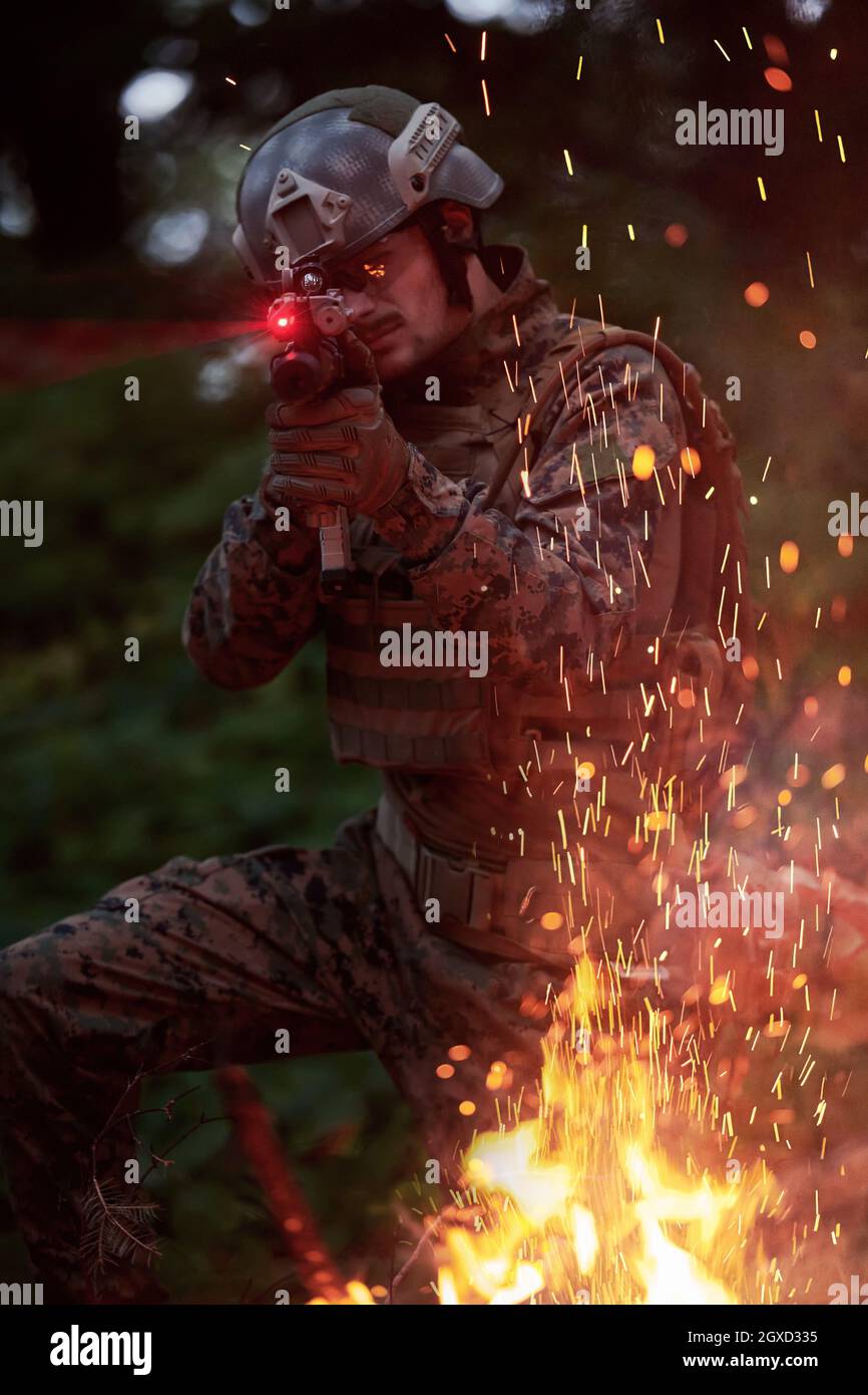 Soldier in Action at Night in the Forest Area. Night Time Military ...