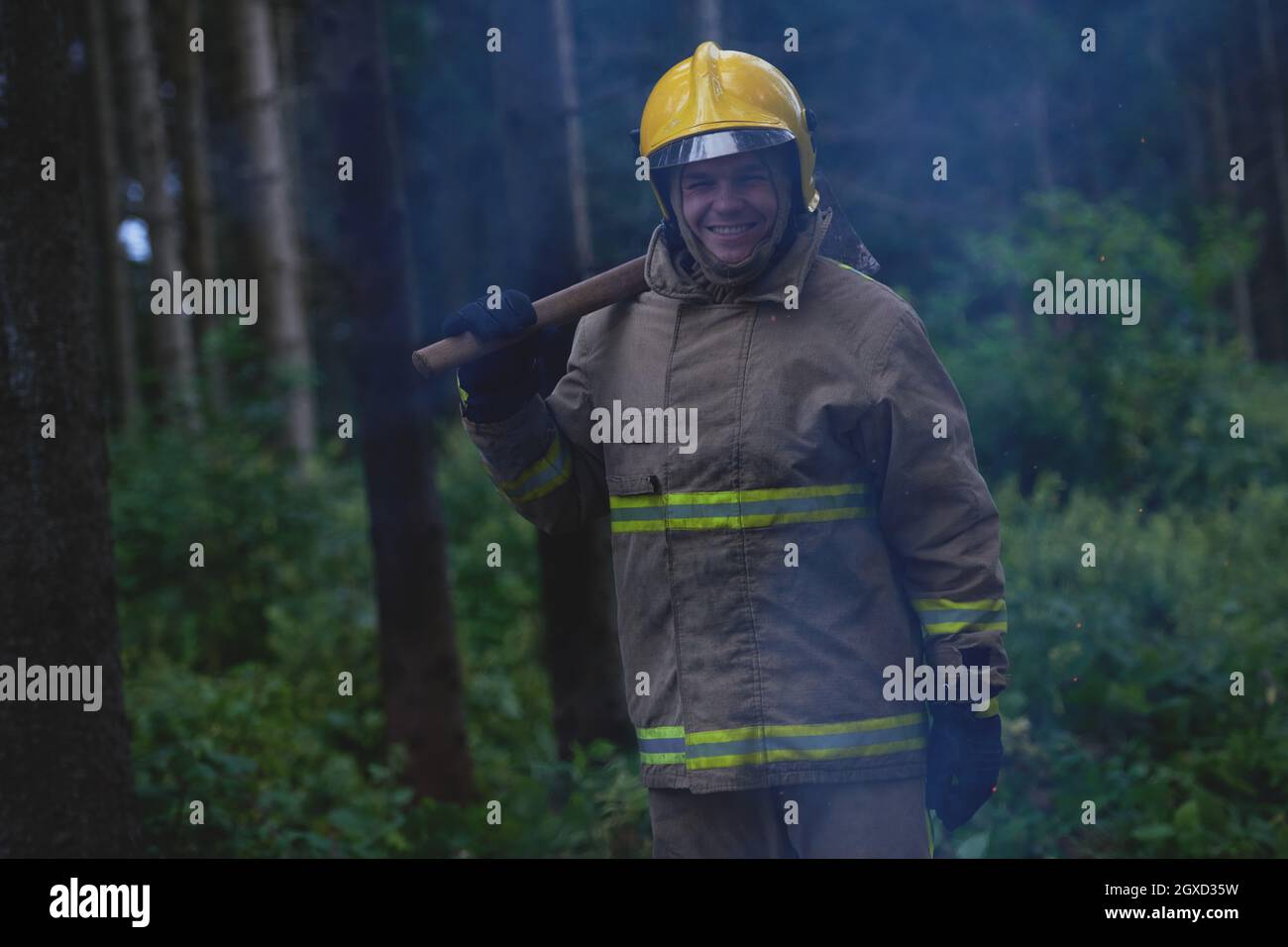 firefighter portrait on authentic fire location in forest Stock Photo ...