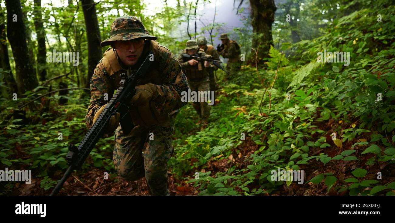 Modern warfare Soldiers Squad Running as Team in Battle Formation Stock ...