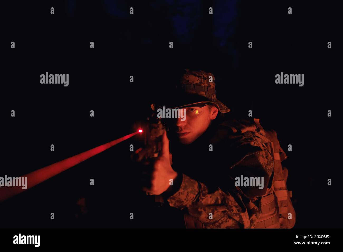 soldiers squad in action on night mission using laser sight beam lights ...