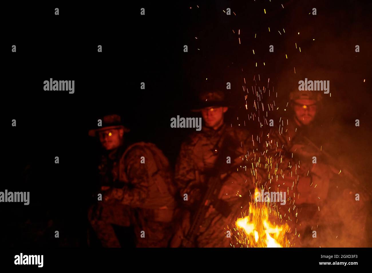 soldiers squad in action on night mission using laser sight beam lights ...