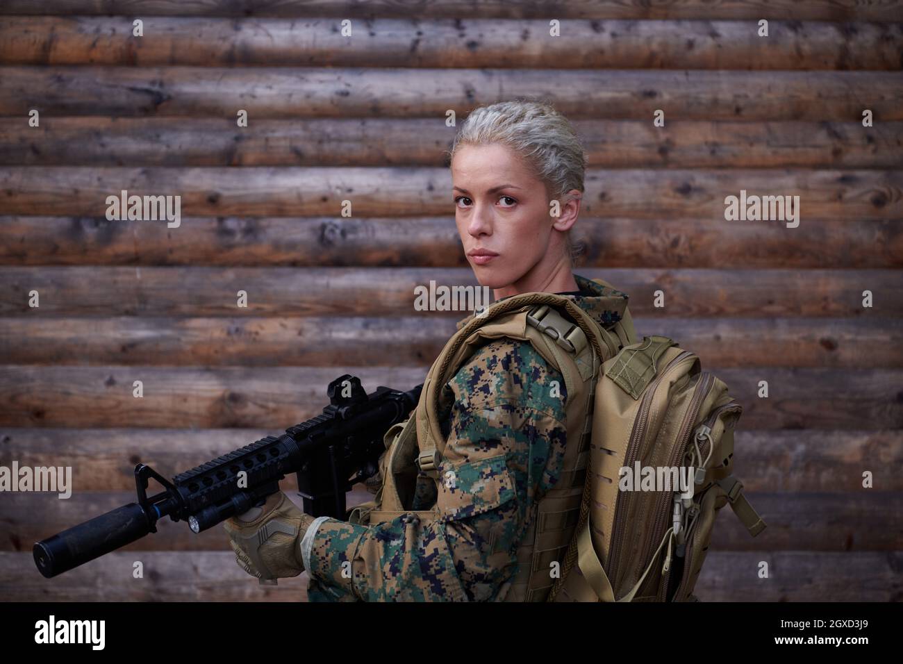 woman soldier ready for battle wearing protective military gear and ...