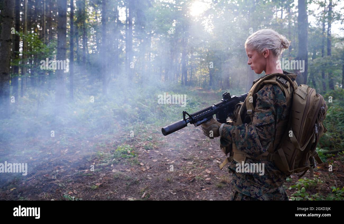 woman soldier ready for battle wearing protective military gear and ...