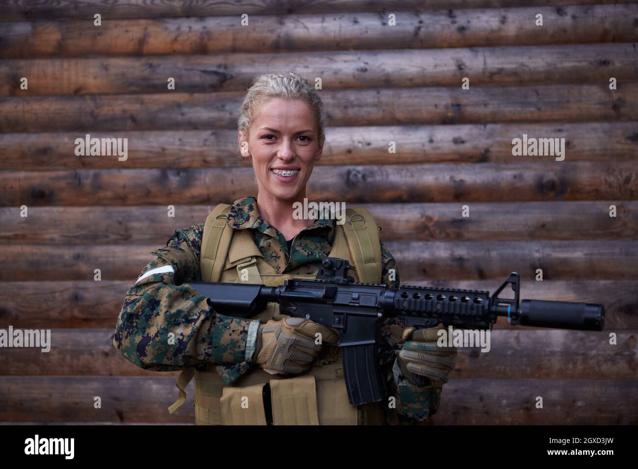 woman soldier ready for battle wearing protective military gear and ...