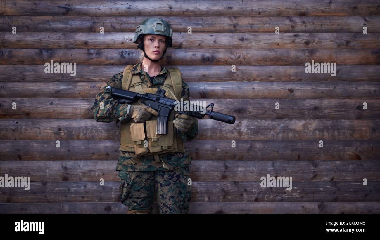 woman soldier ready for battle wearing protective military gear and ...