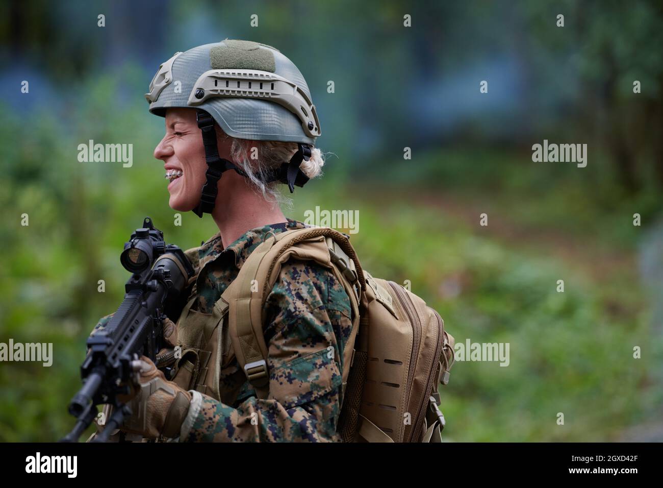 woman soldier ready for battle wearing protective military gear and ...